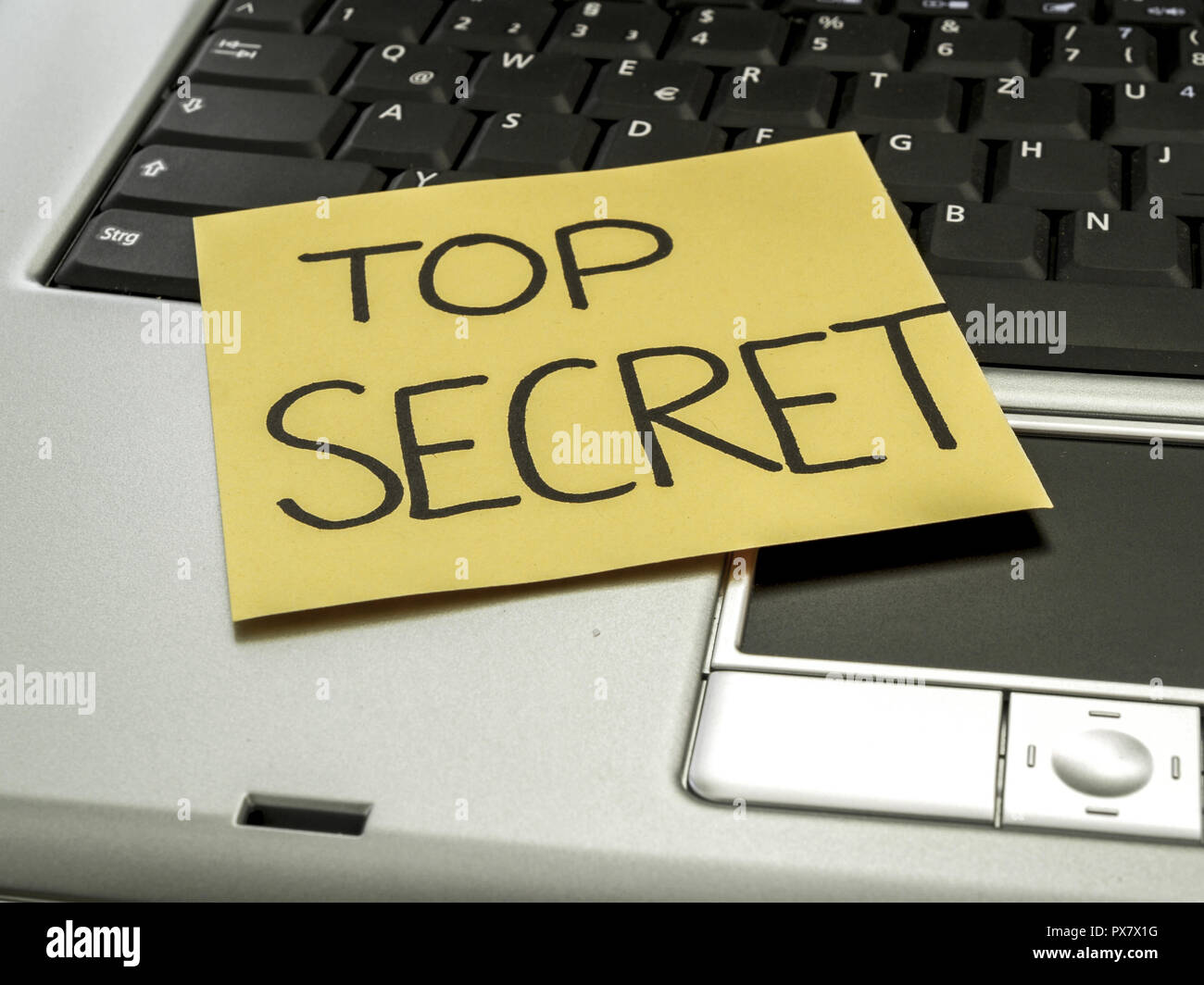 Memo note on notebook, top secret Stock Photo - Alamy