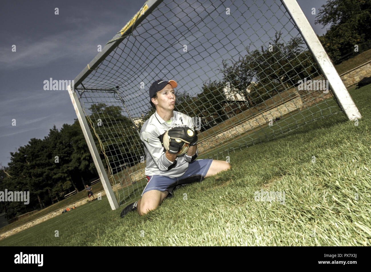 Goalie defending the goal (model-released Stock Photo - Alamy