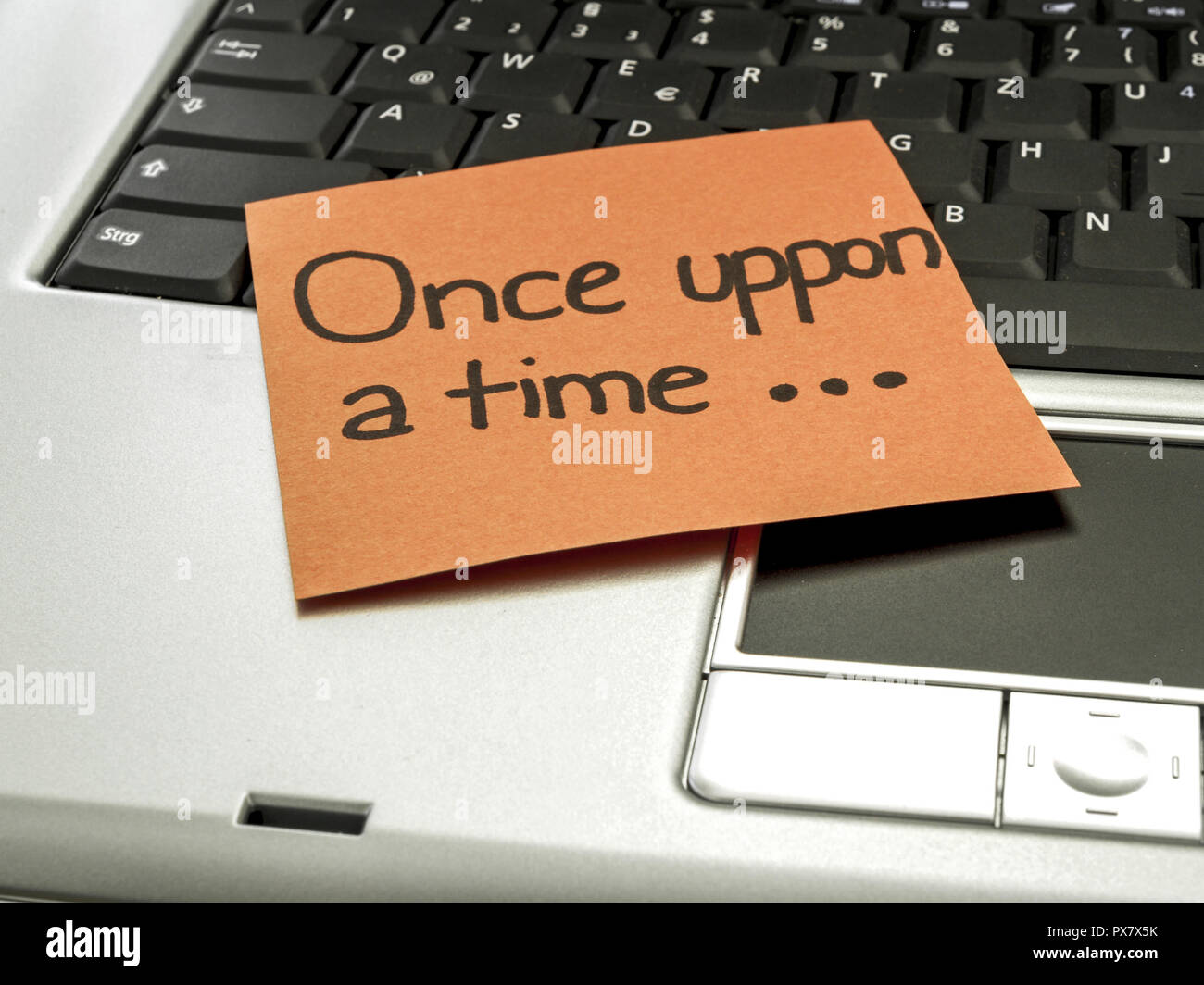 Memo note on notebook, once uppon a time Stock Photo - Alamy