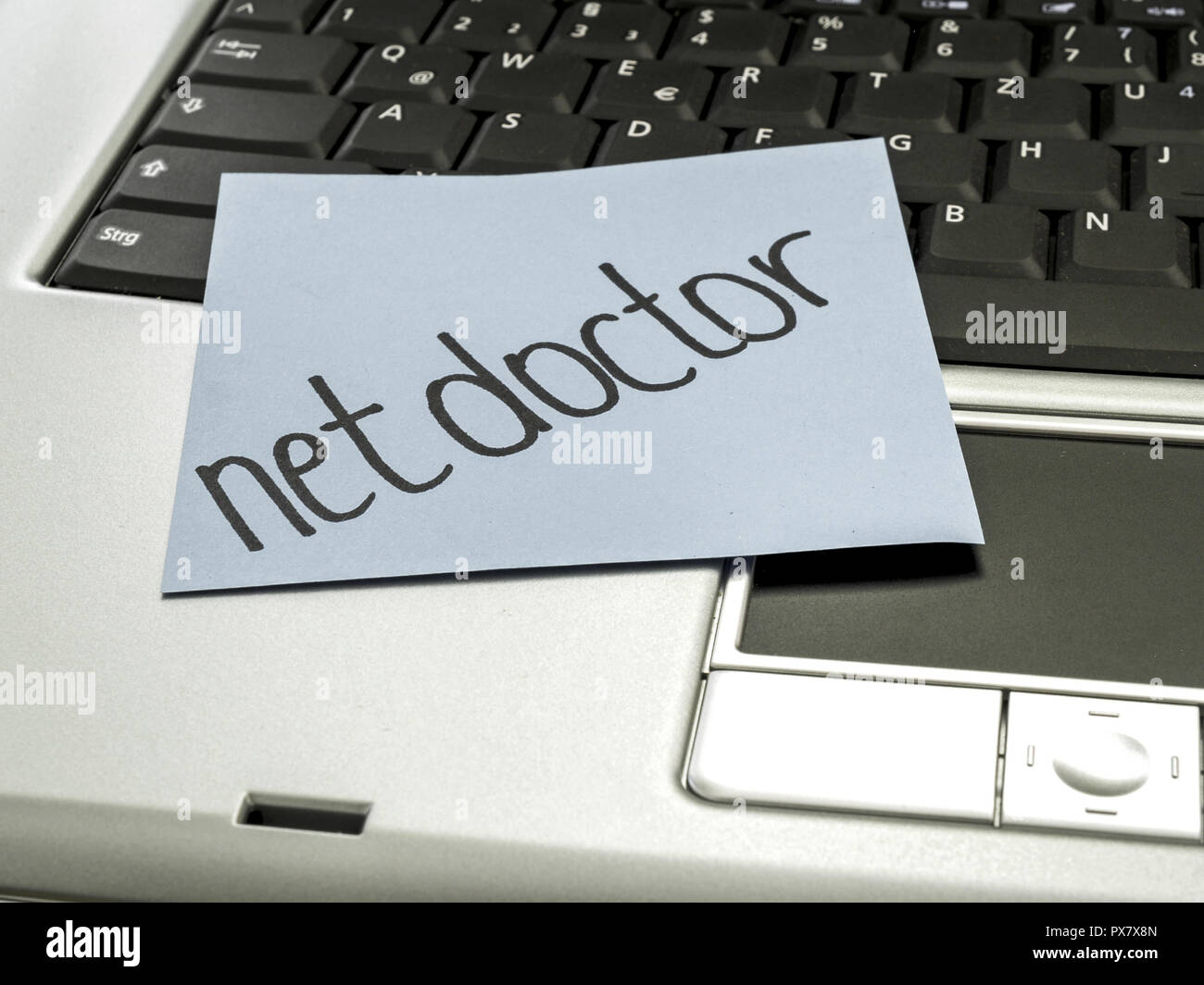 Memo note on notebook, net doctor Stock Photo - Alamy