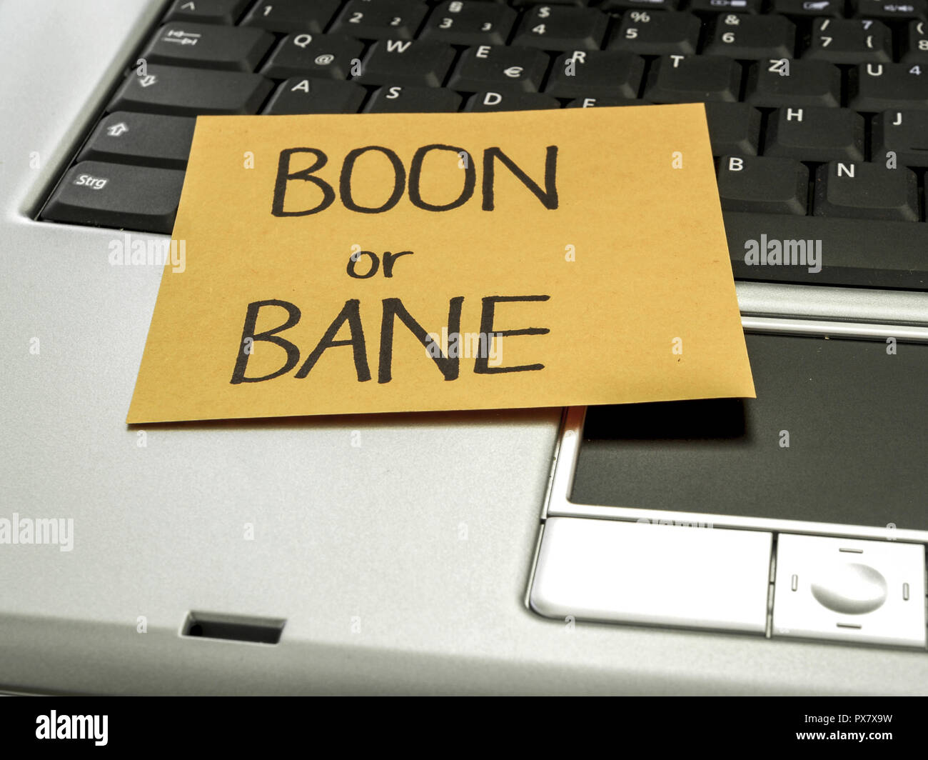 Memo note on notebook, boon or bane Stock Photo - Alamy