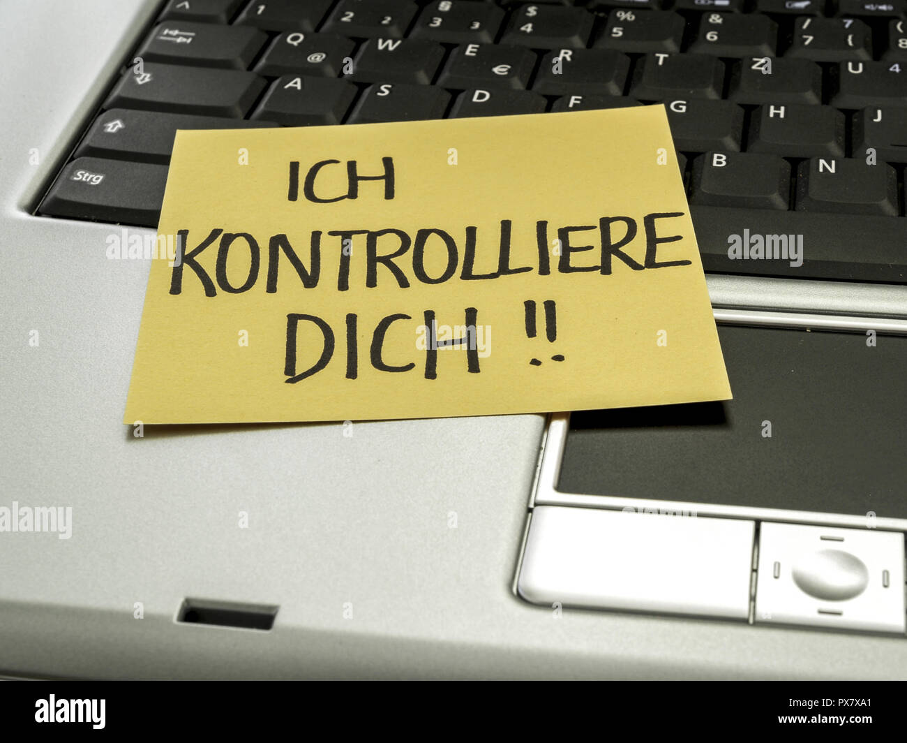 Memo note on notebook, you are under my control Stock Photo - Alamy