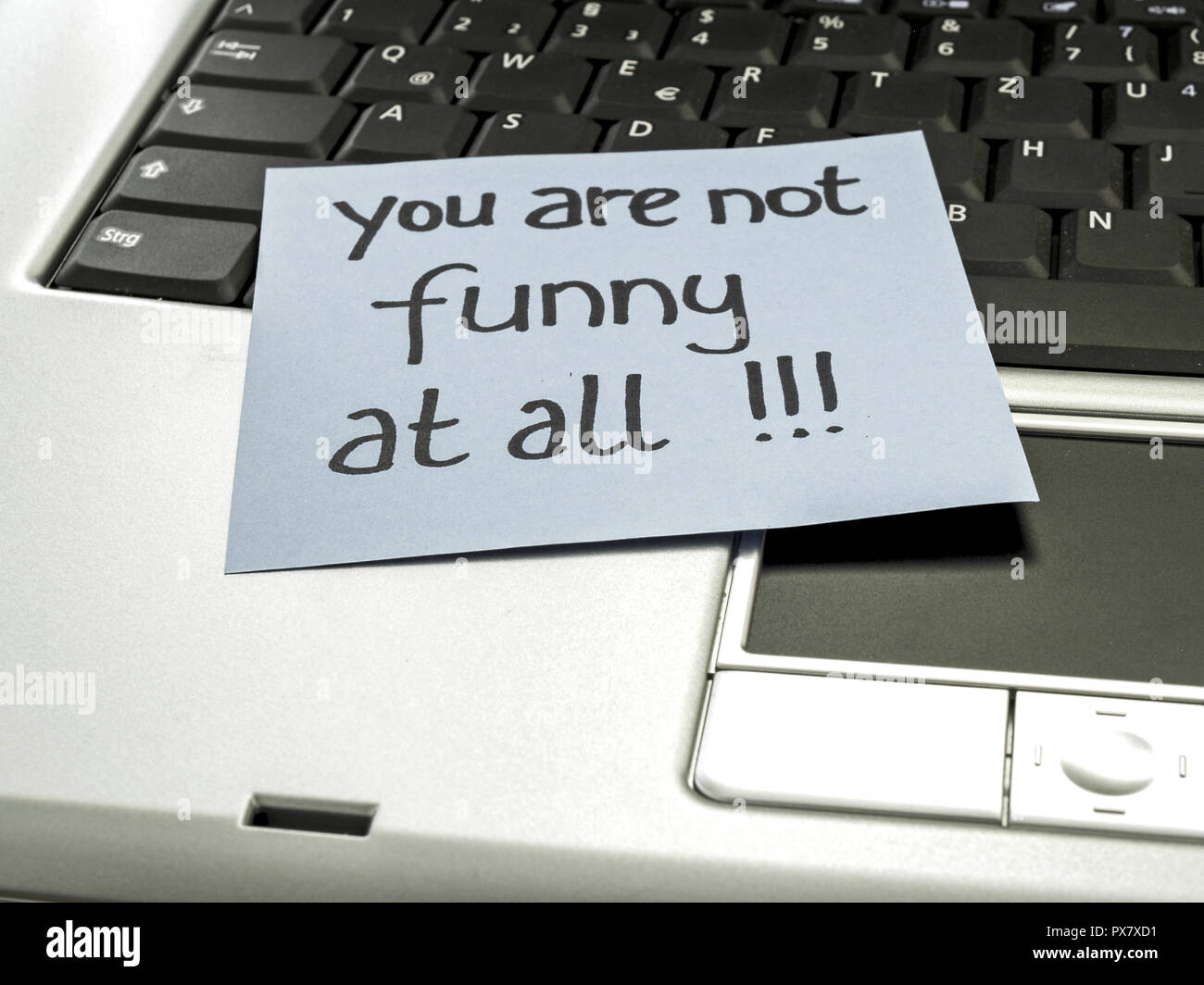 Memo note on notebook, you are not funny at all Stock Photo - Alamy