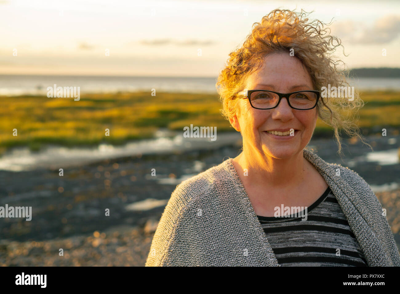 A woman on the beach at the sunset in spring season Stock Photo - Alamy