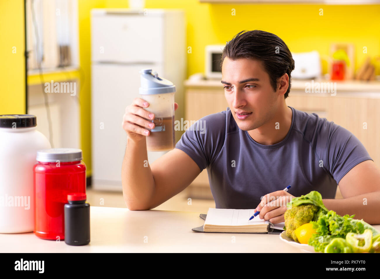 Young man in healthy eating concept Stock Photo - Alamy