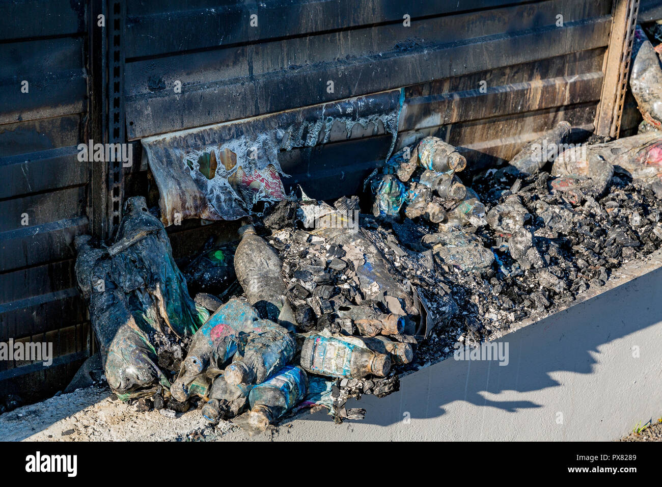 Close up damaged industry supermarket metallic facade after arson fire ...