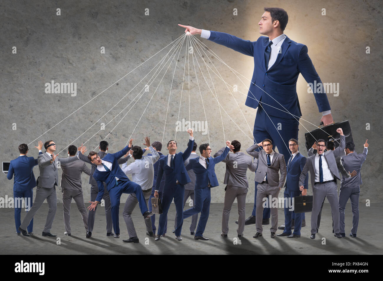 Boss employee manipulating his staff in business concept Stock Photo ...