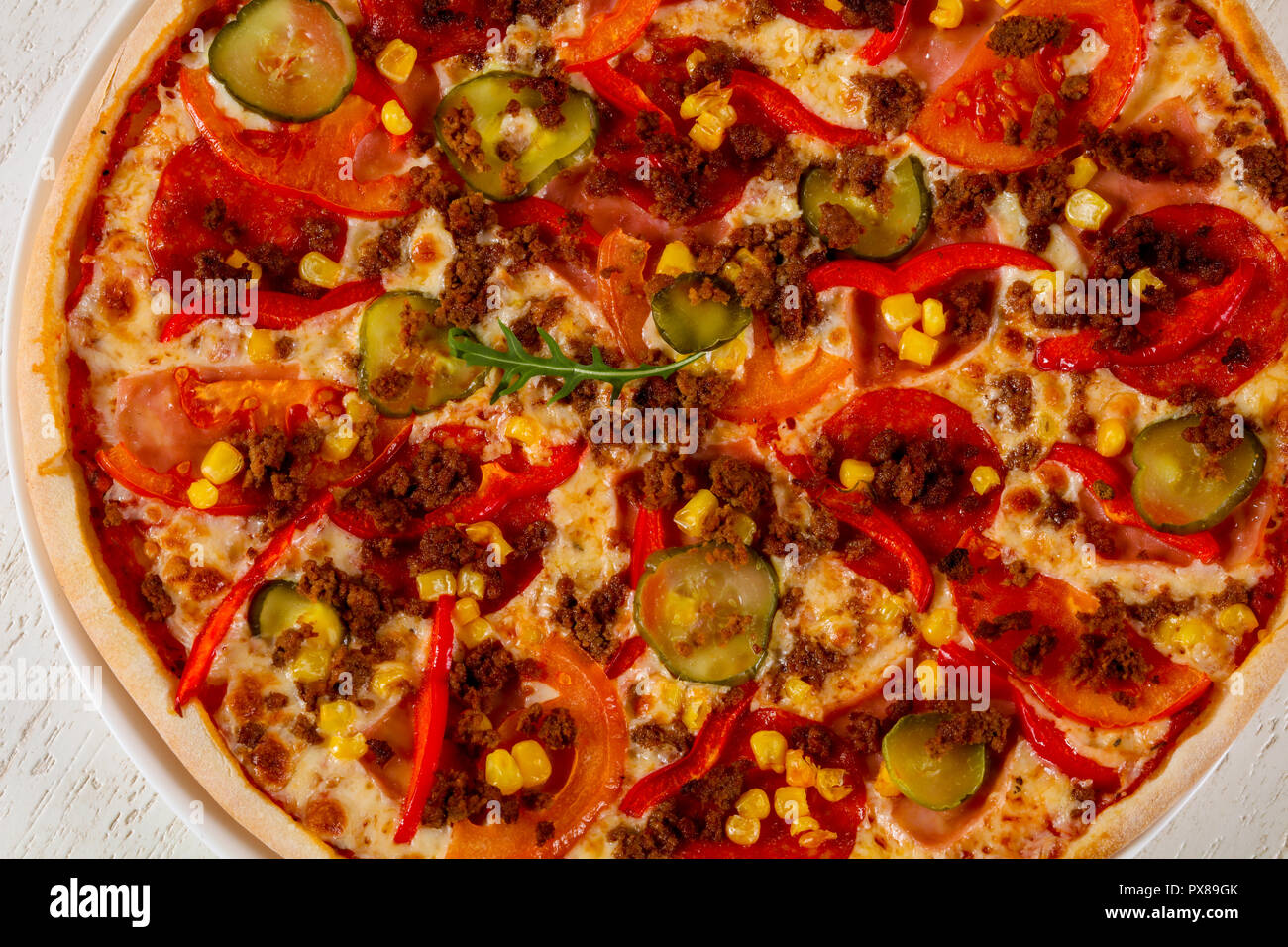 Pizza with minced meat and tomato Stock Photo - Alamy