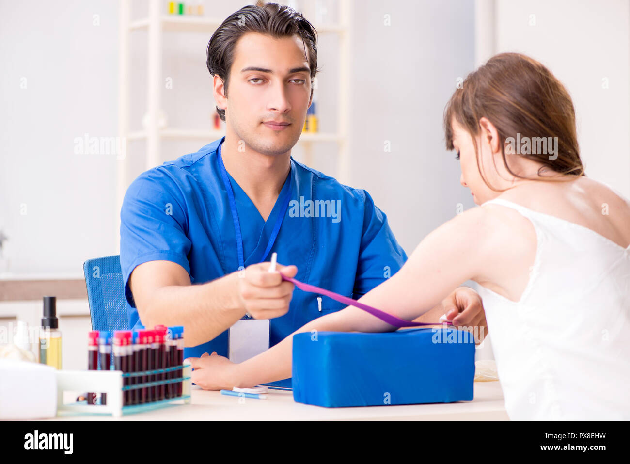 Young patient during blood test sampling procedure Stock Photo - Alamy