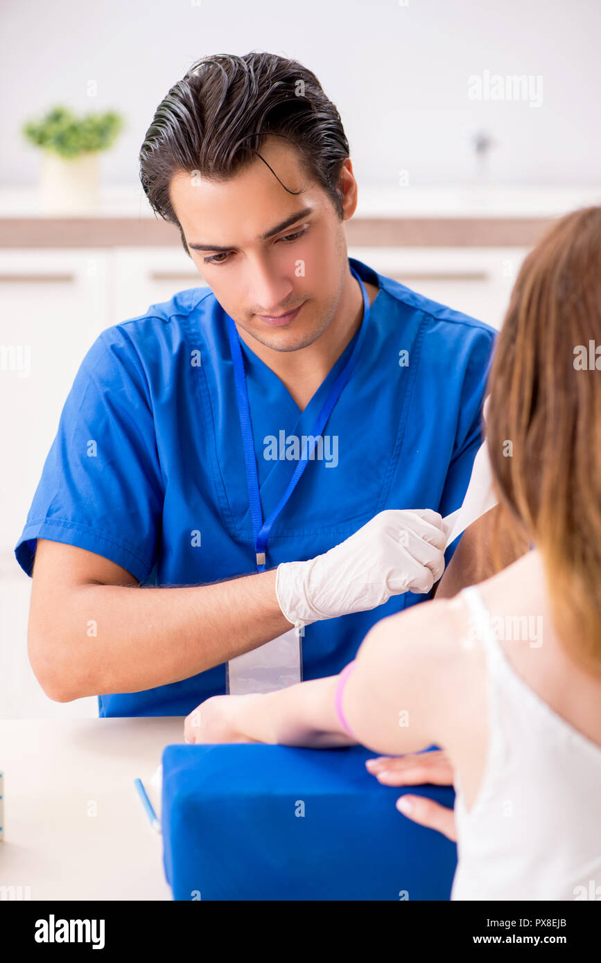 Young patient during blood test sampling procedure Stock Photo - Alamy