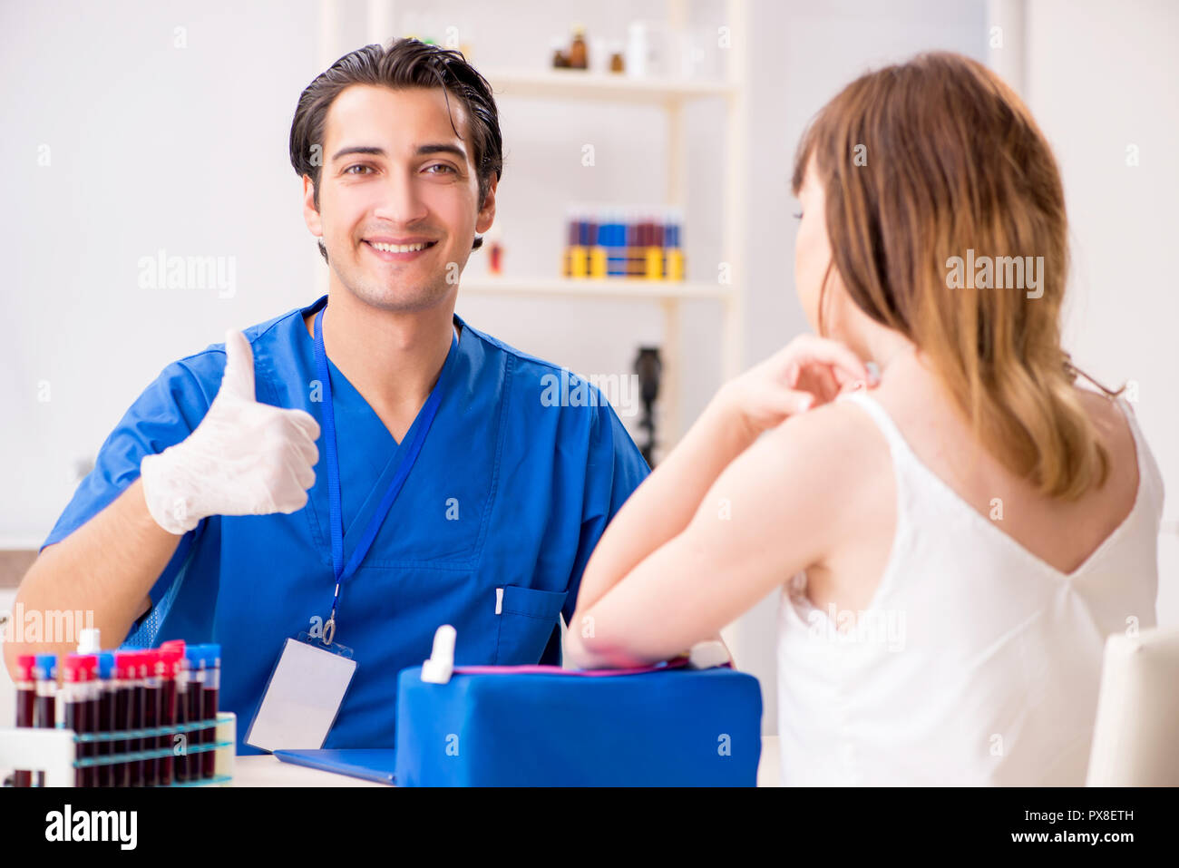 Young patient during blood test sampling procedure Stock Photo - Alamy