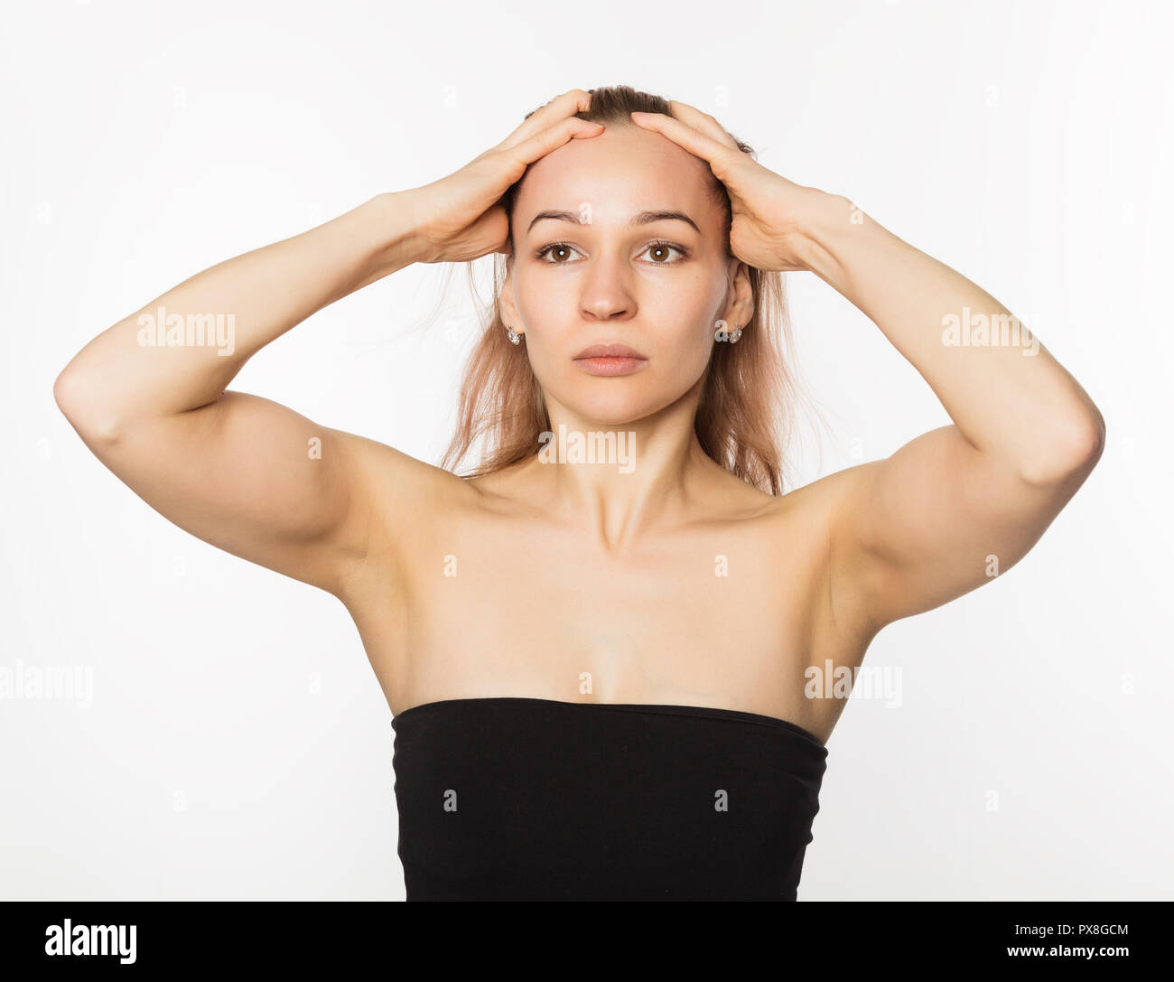 beautiful girl performs anti-aging exercises. face fitness for anti ...