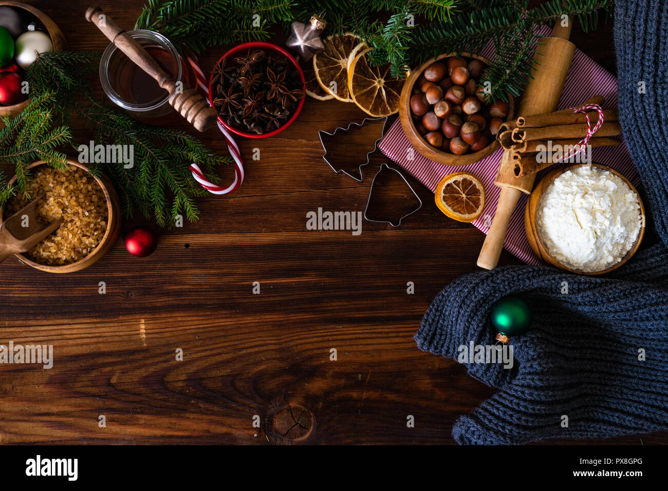Christmas cooking concept with flour, brown sugar, nuts, cinnamon and ...