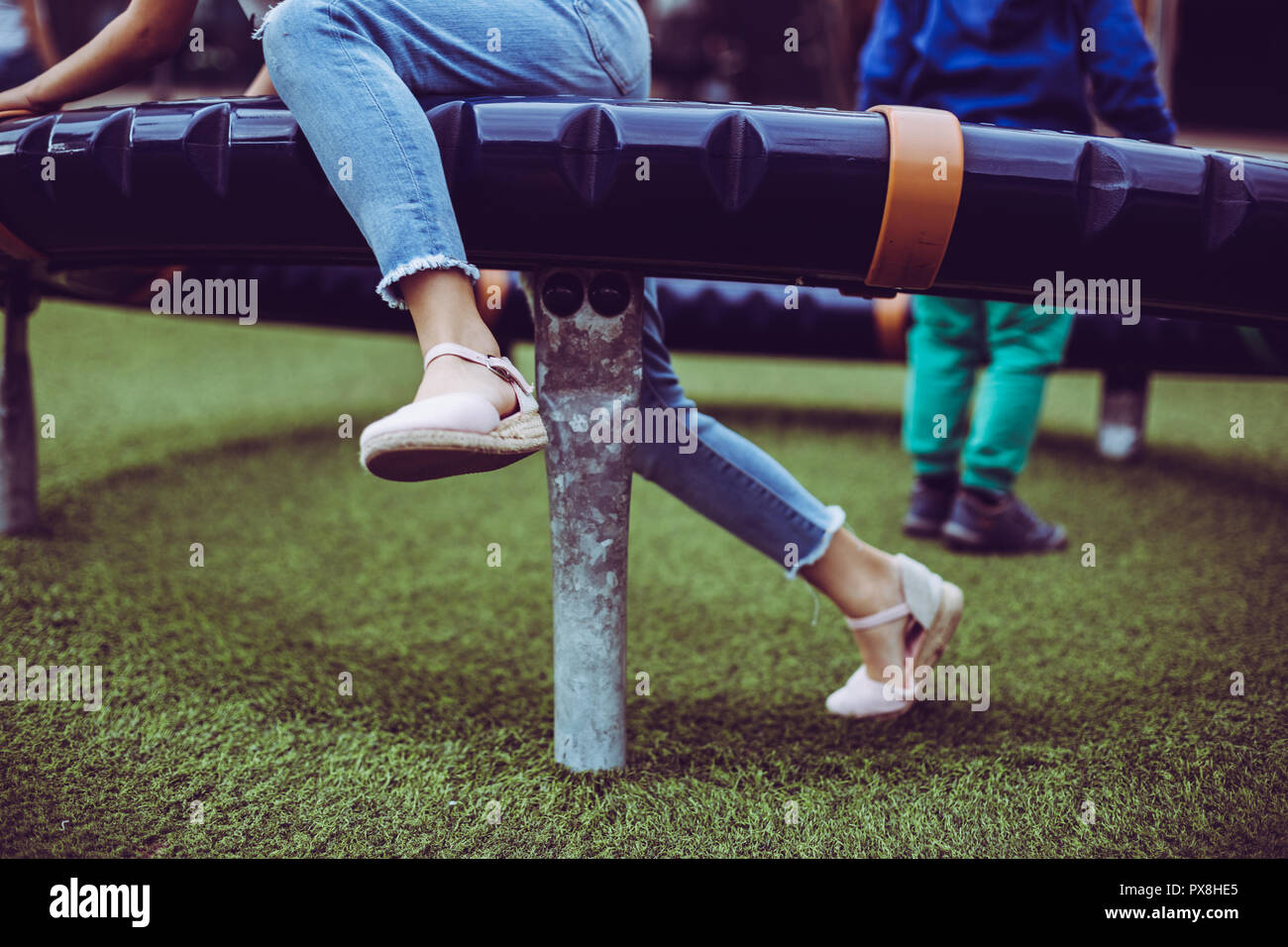 Kids legs in playground Stock Photo - Alamy