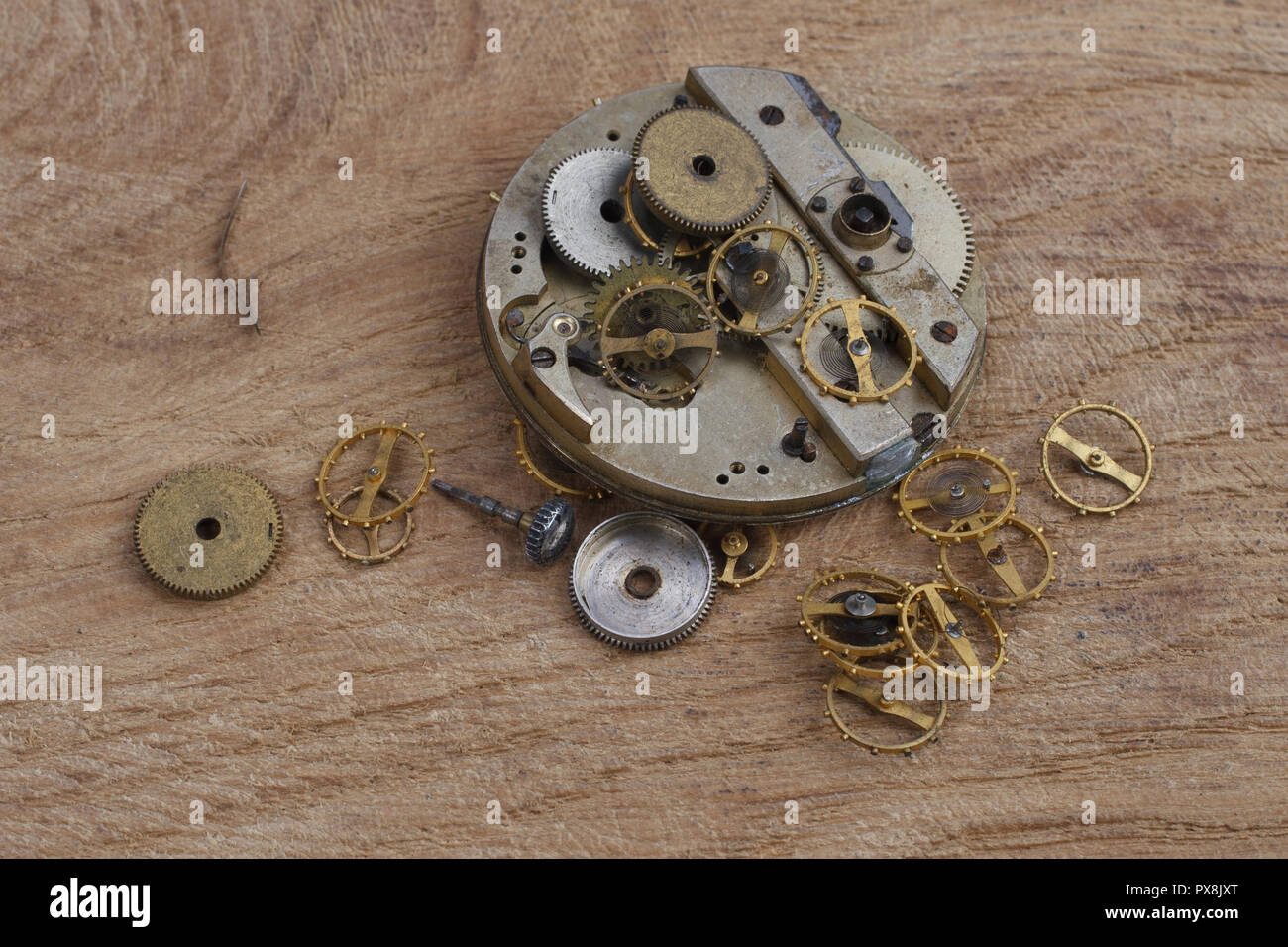 Time concept - broken vintage pocket watch on wooden desk Stock Photo ...
