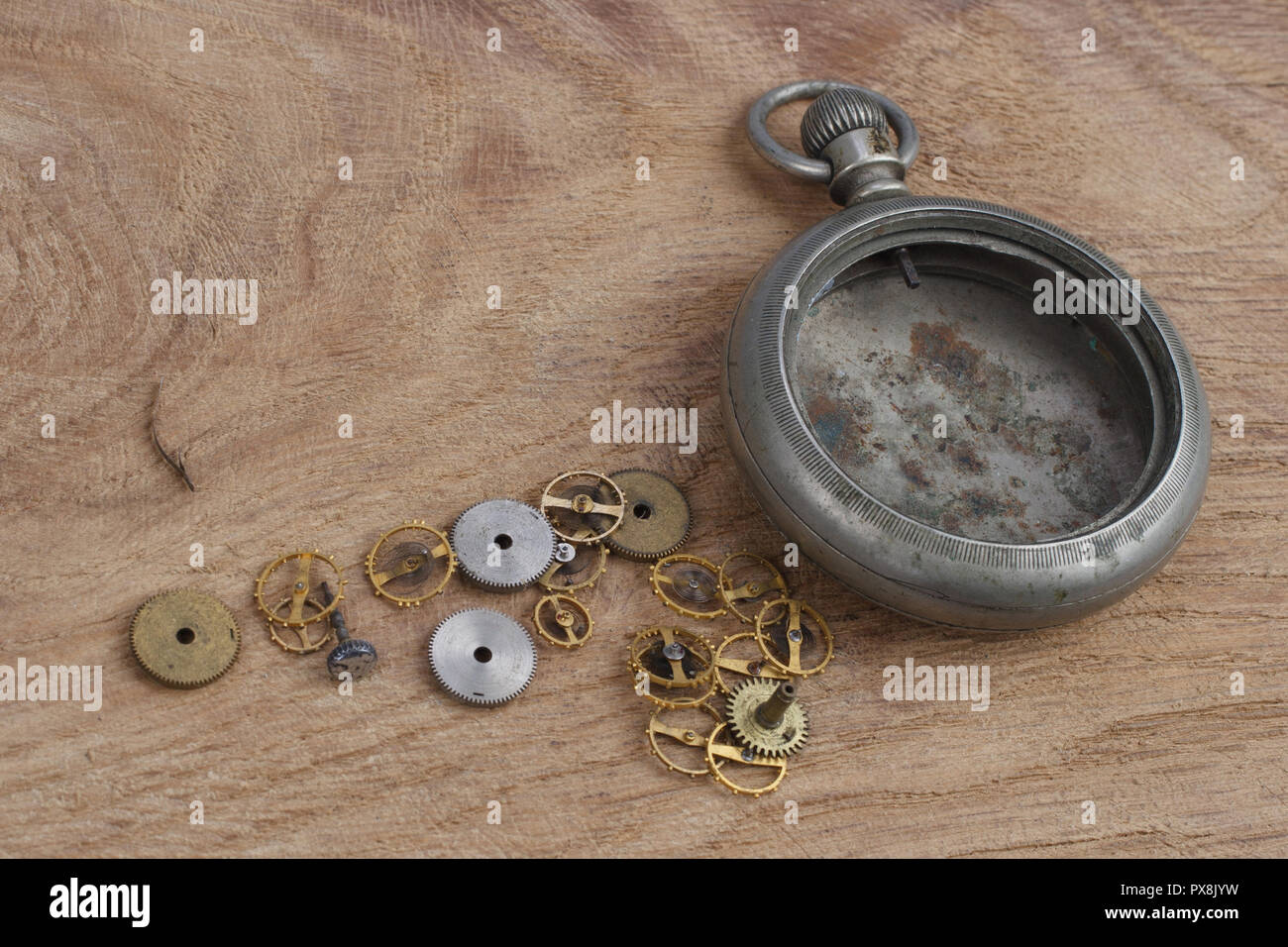 Time concept - broken vintage pocket watch on wooden desk Stock Photo ...