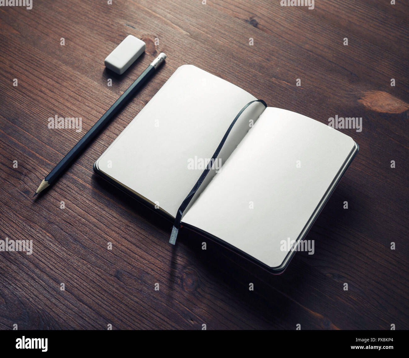 Blank diary, pencil and eraser on wooden background. Responsive design ...