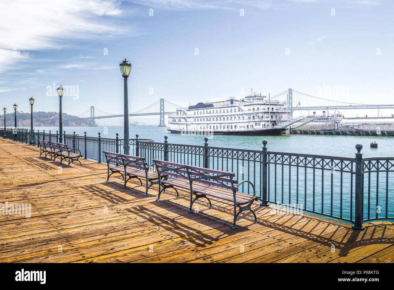 Historic Pier 7 with traditional paddleboat and Oakland Bay Bridge in ...