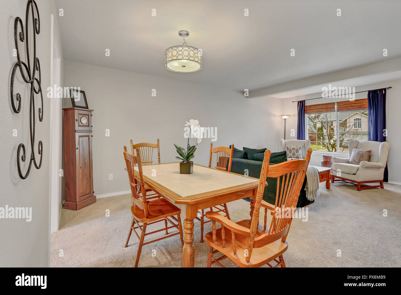 Open sunny space with living and dining room interior Stock Photo - Alamy