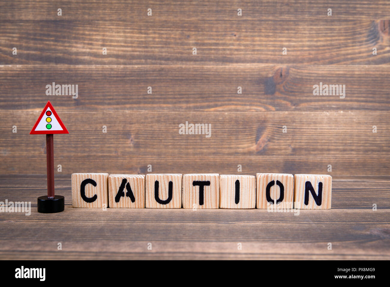 Caution Name from wooden letters with a traffic light road sign Stock ...