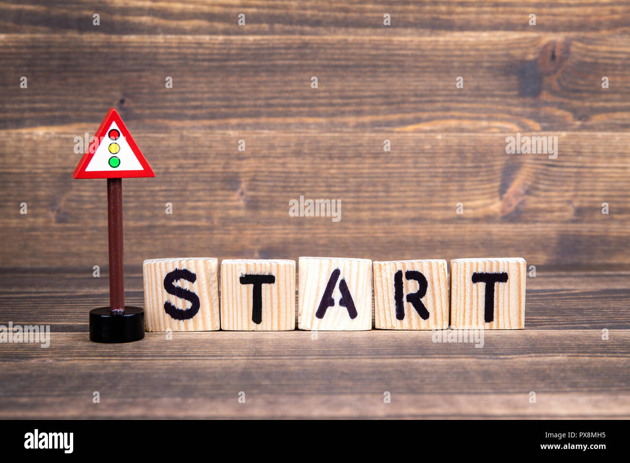Start Name from wooden letters with a traffic light road sign Stock ...