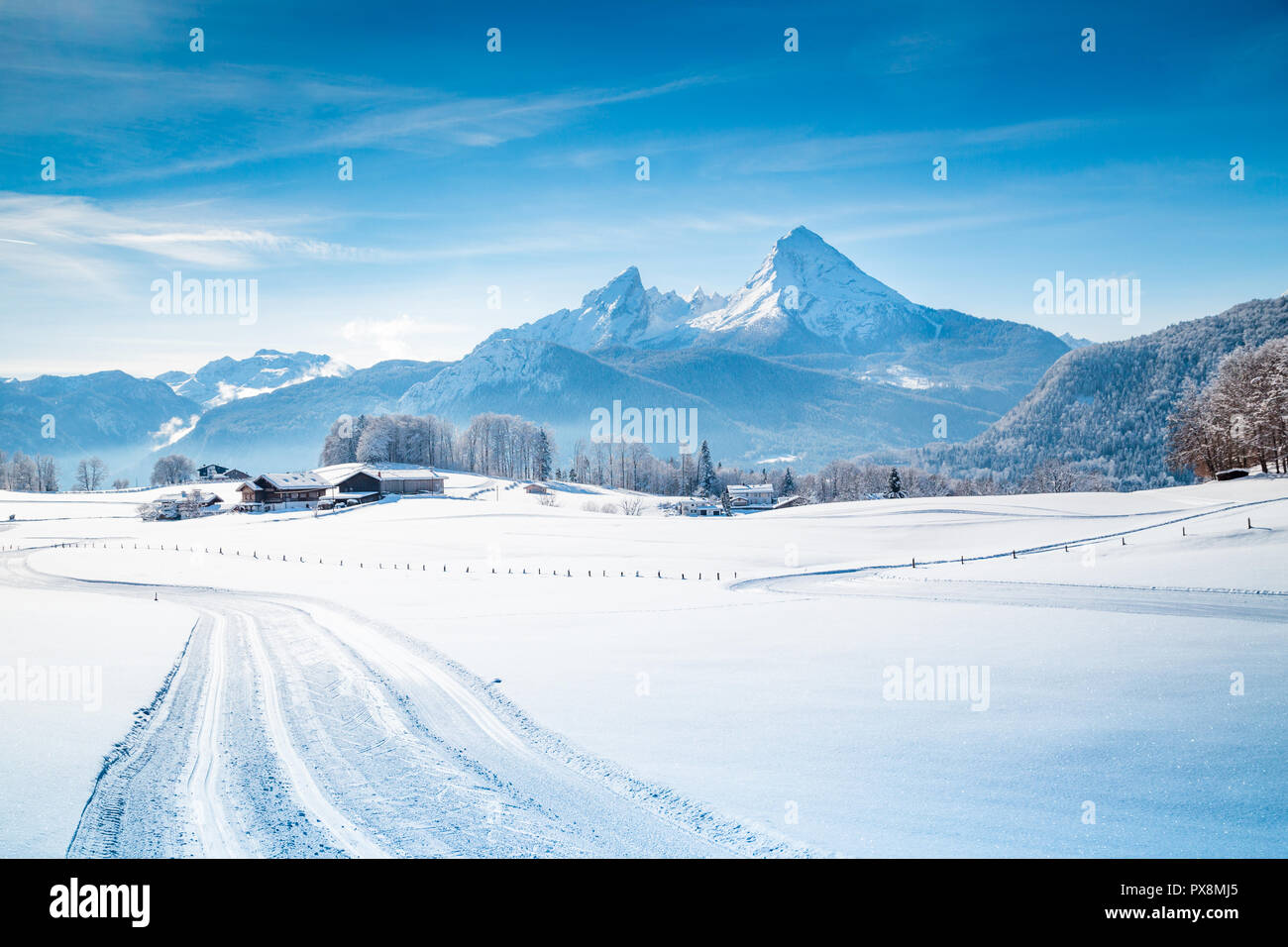 Beautiful winter scenery in the Alps on a cold sunny day with blue sky ...