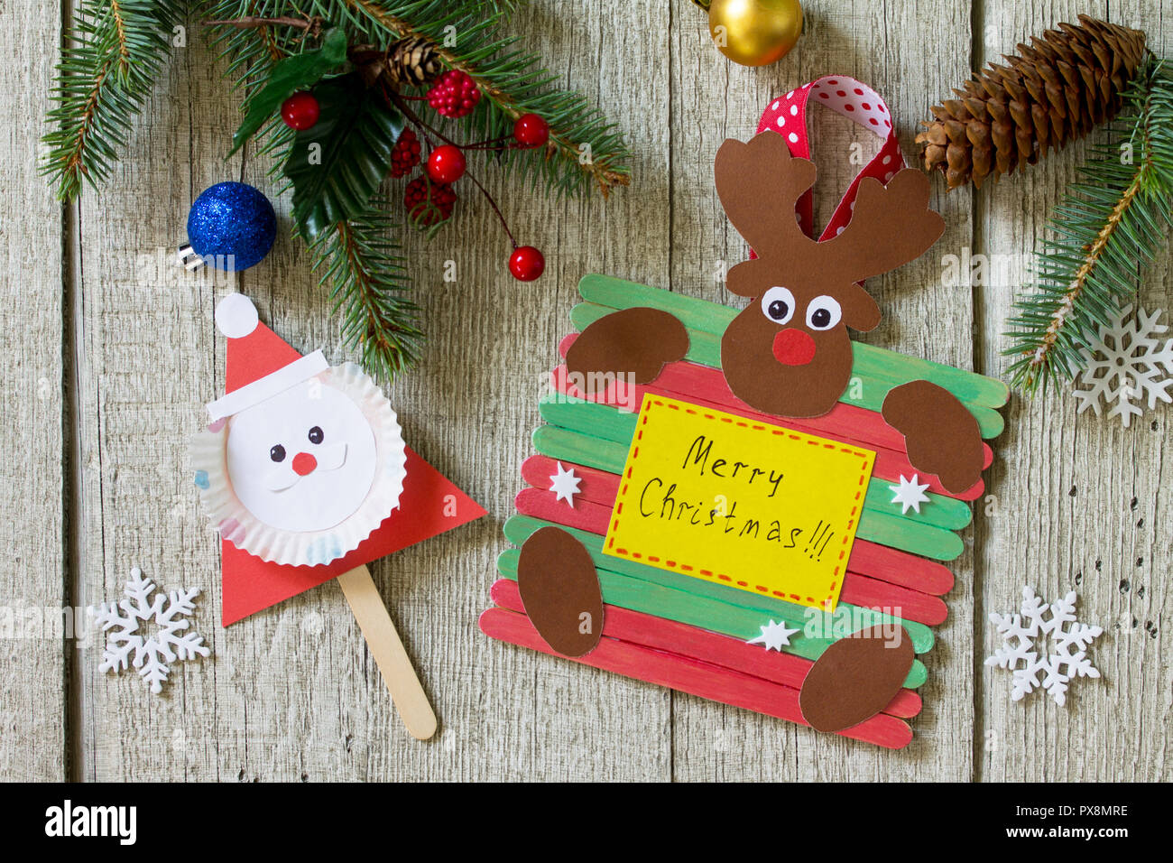 Christmas merry gift on wooden table - Santa and Reindeer toys ...
