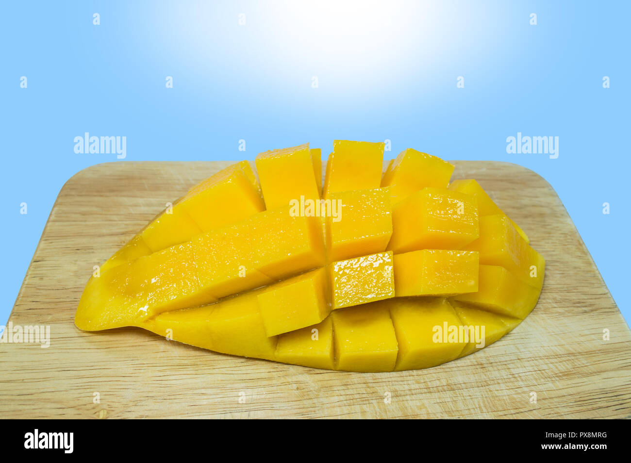 Mango fruit on chopping board hi-res stock photography and images - Alamy