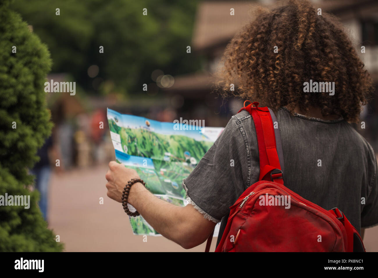 tourist with route maps looking for a way in city. search landmarks ...