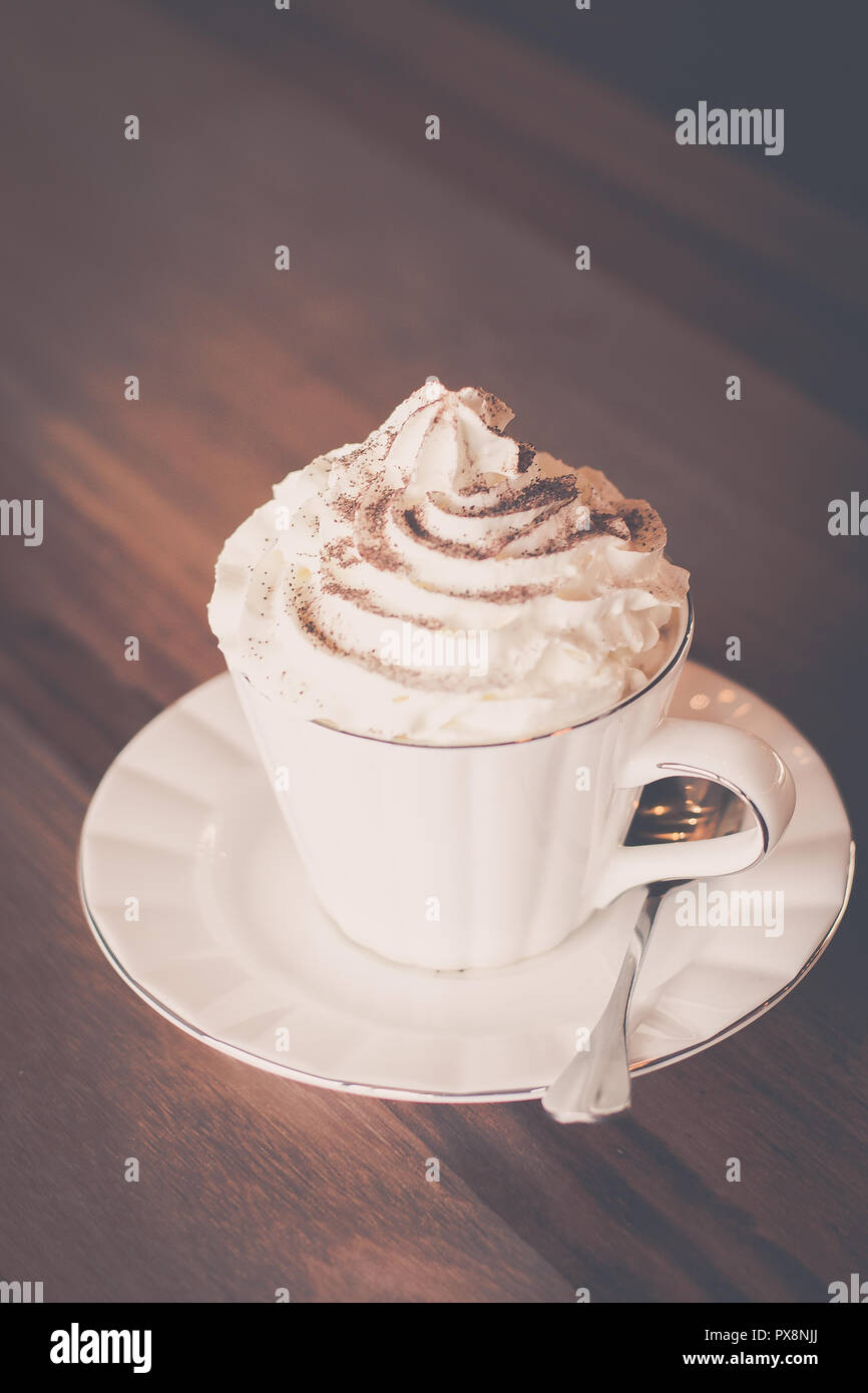 Vienna Coffee in white china coffee cup and tea spoon Stock Photo - Alamy