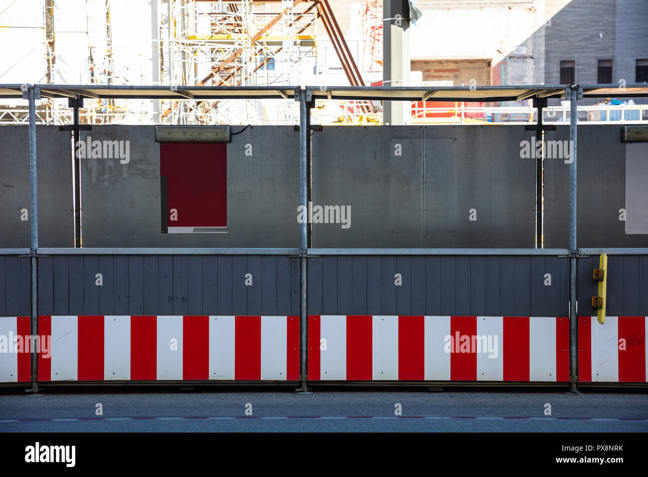 Construction site. Protective corridor for pedestrians along the street ...