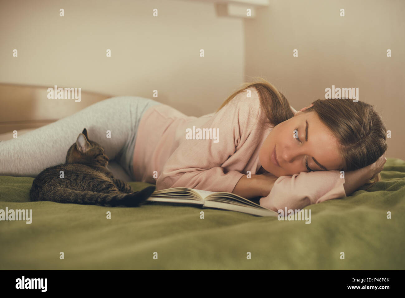 Young woman napping cat hi-res stock photography and images - Alamy