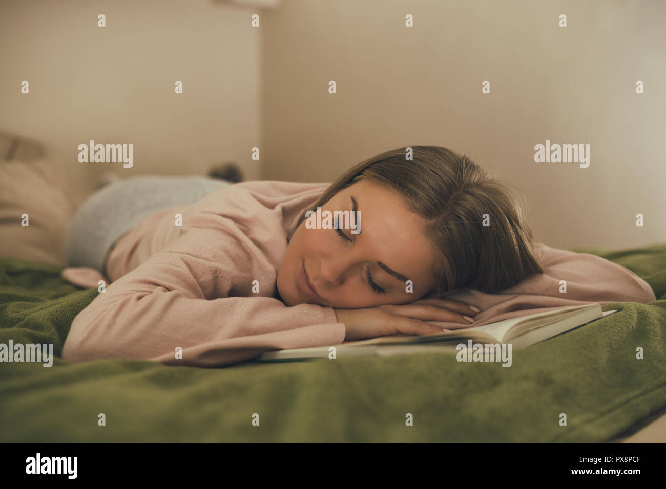 Beautiful woman fall asleep while reading a book Stock Photo - Alamy