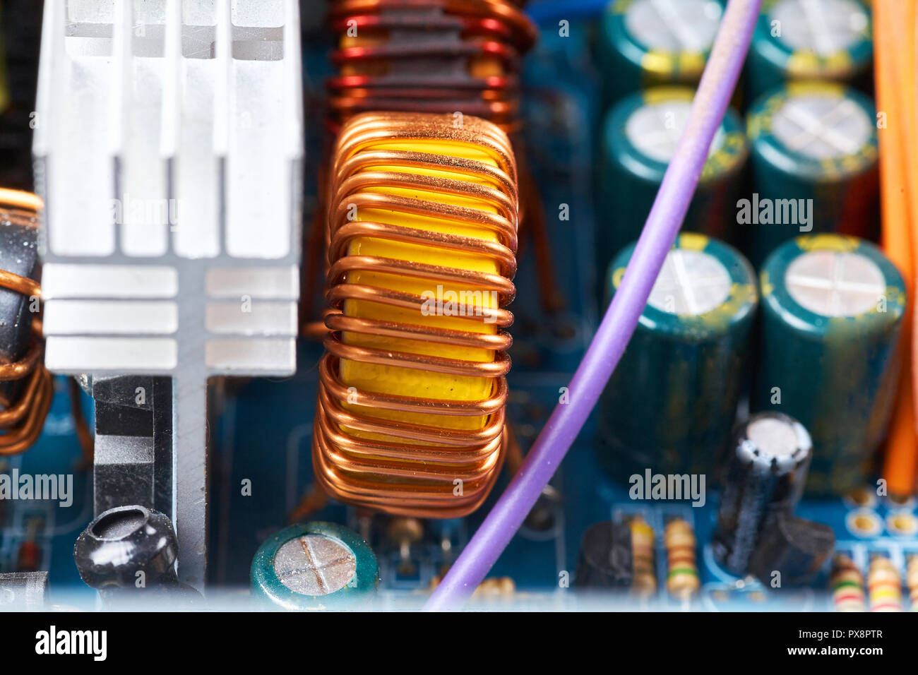 Microchip, capacitors, resistors on a computer board close-up ...