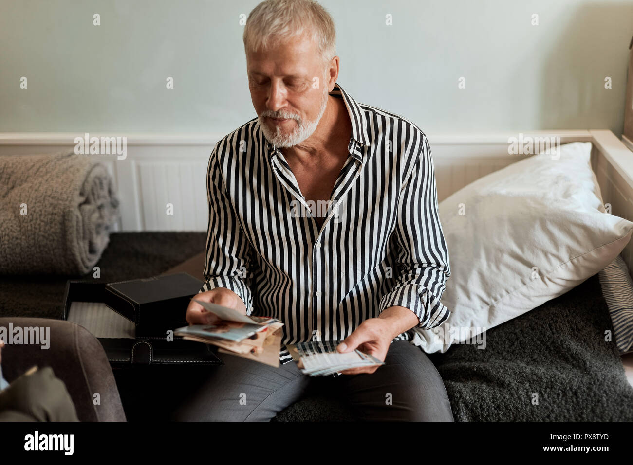 Old man reminiscing hi-res stock photography and images - Alamy