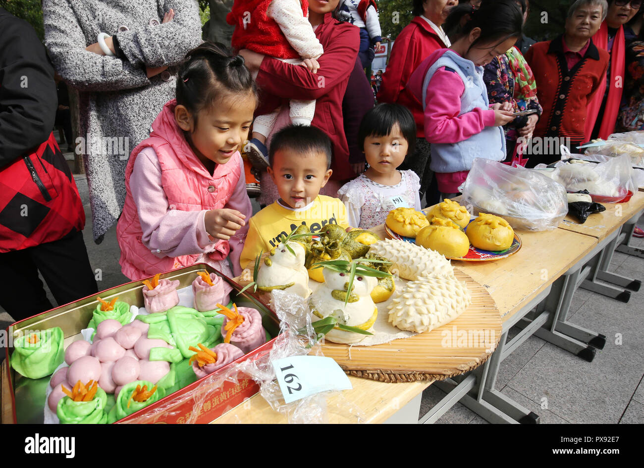 Weifang, China's Shandong Province. 20th Oct, 2018. People look at ...