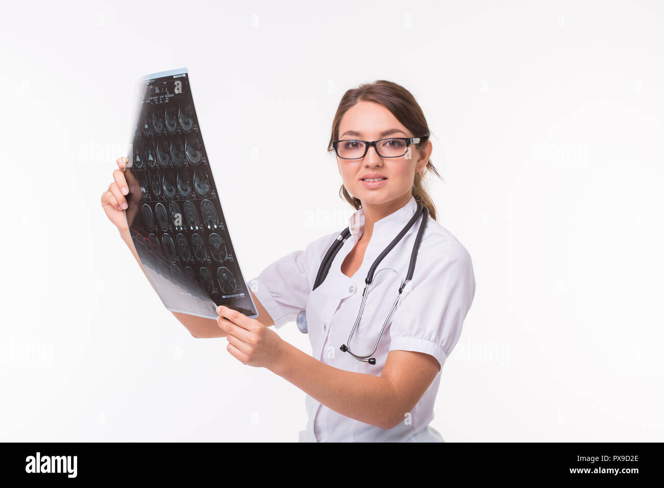 Young female doctor looking at x-ray image on white background. Mri ...