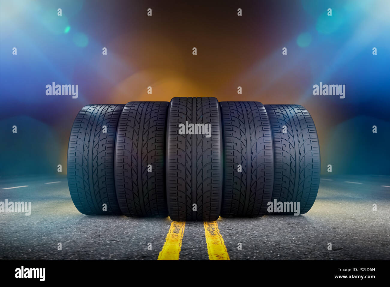 Five car tires standing on a road with red and blue lights at ...