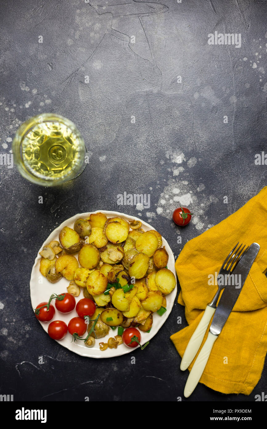 Table setting for holiday dinner. Fried potatoes with mushrooms and ...