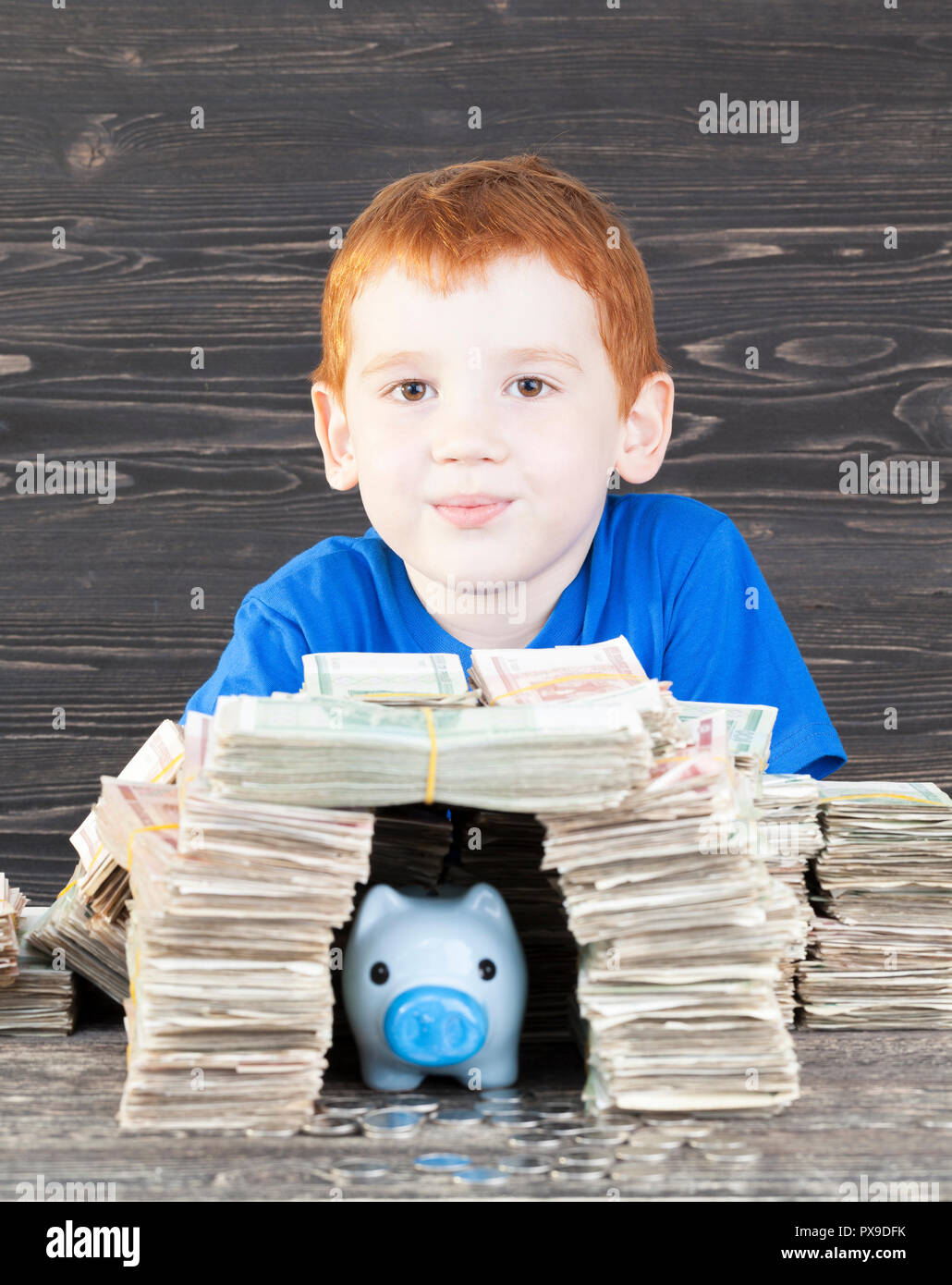 boy built for his blue pig piggy bank with coins house of packs of ...