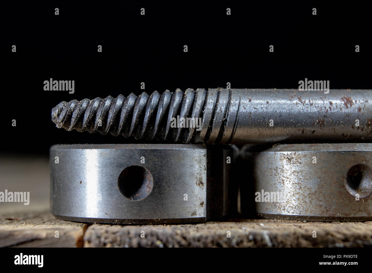 Metalwork tools on the workshop table. Threading dies and taps in an ...