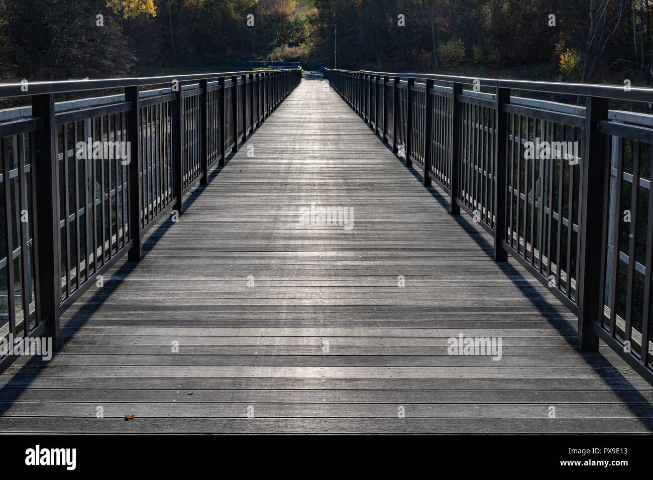 A bridge made of planks in central europe. Crossing the river built on ...