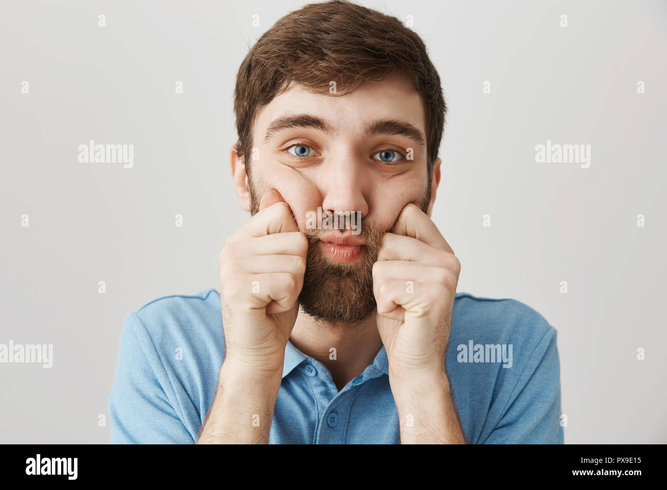 Squeezing cheeks hi-res stock photography and images - Alamy