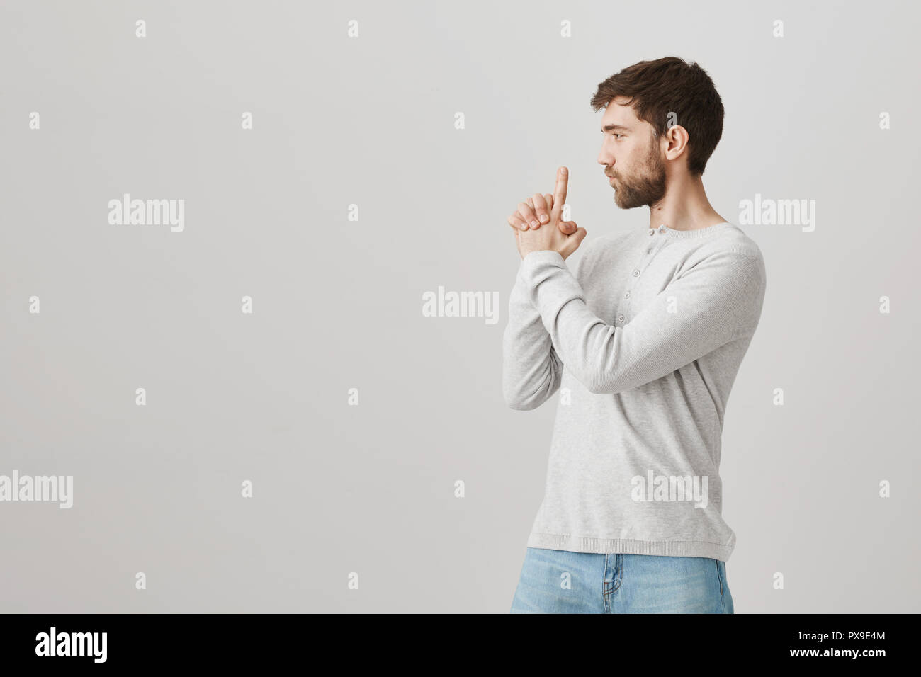 Profile portrait of playful attractive caucasian guy with beard ...