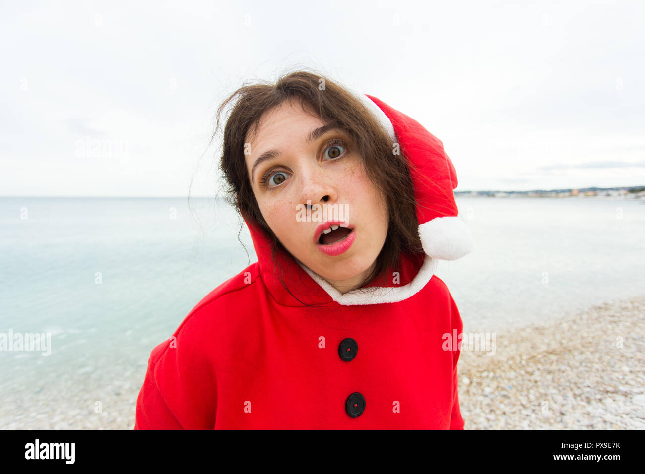 Christmas and holiday concept - Funny woman in Santa Claus costume ...