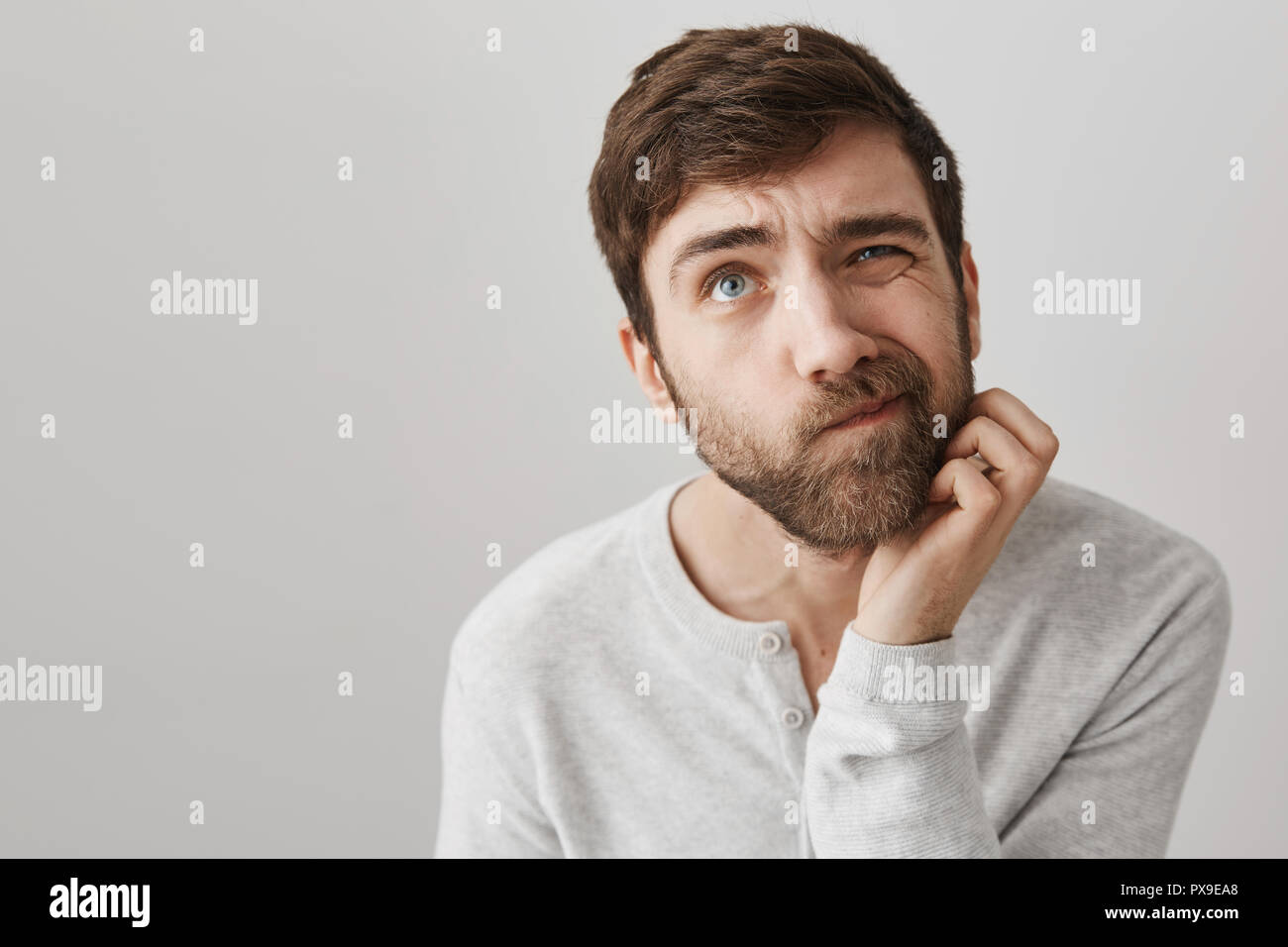 Scratching beard hi-res stock photography and images - Alamy