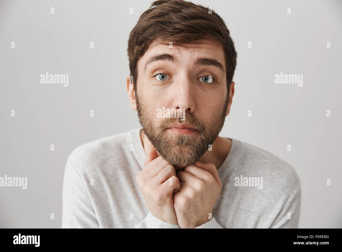 Man holding happy sad emotions face hi-res stock photography and images ...