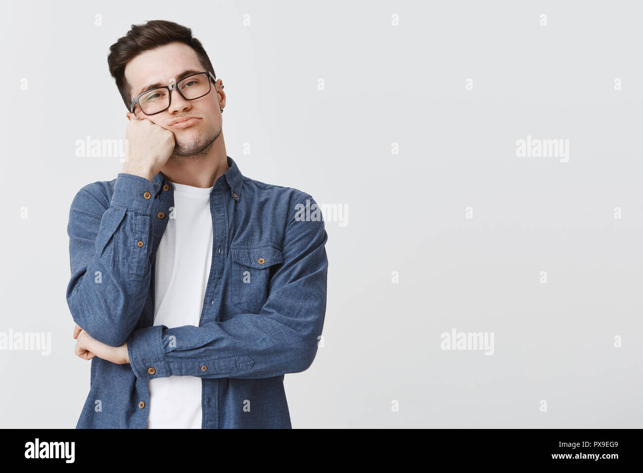 Bored tired unimpressed man hi-res stock photography and images - Alamy