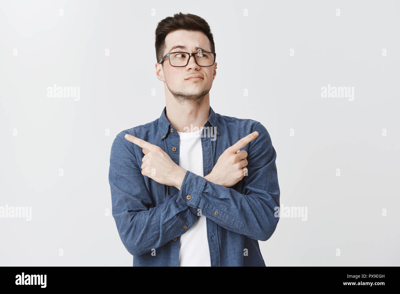 Waist-up shot of hesitant unsure attractive caucasian young man with ...