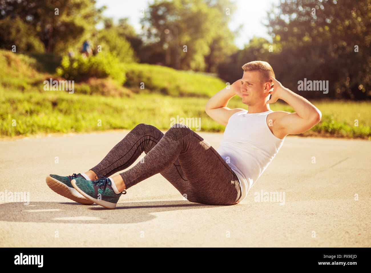 Young man exercising outdoor Stock Photo - Alamy